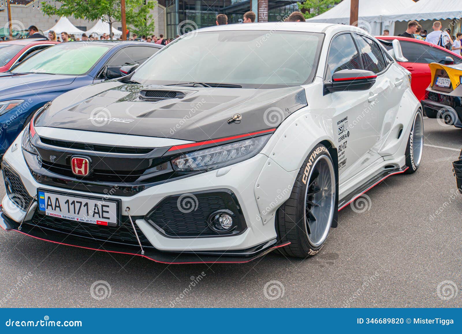 A Modified Honda Car is Shown on Display with an Aggressive Body Kit ...