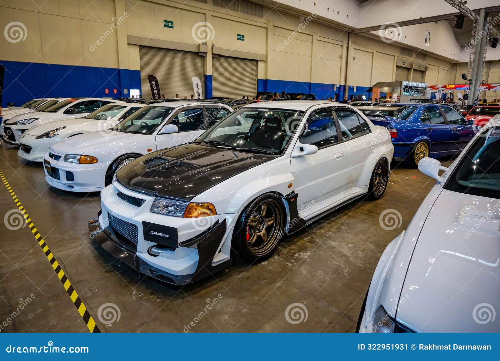Modified White Mitsubishi Lancer Evolution V in the Elite Showcase 2024 ...