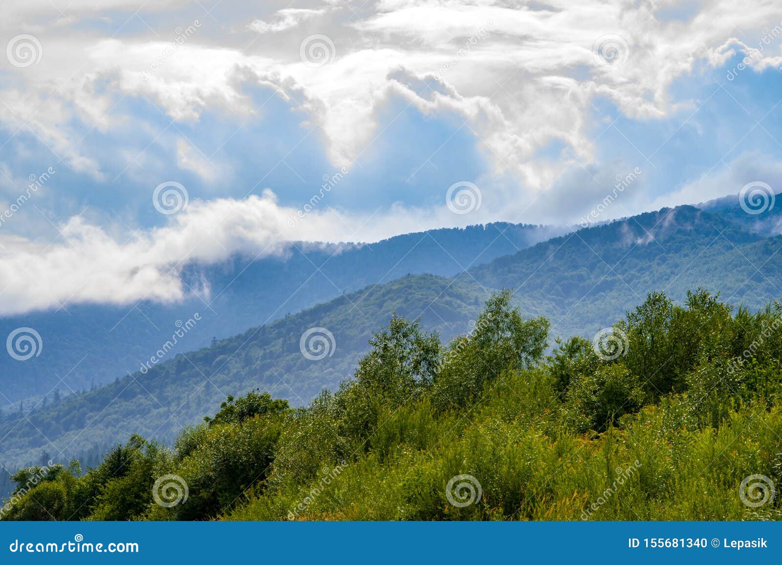 Moisture in the Form of a Pair of Mountains Rising into the Clouds ...