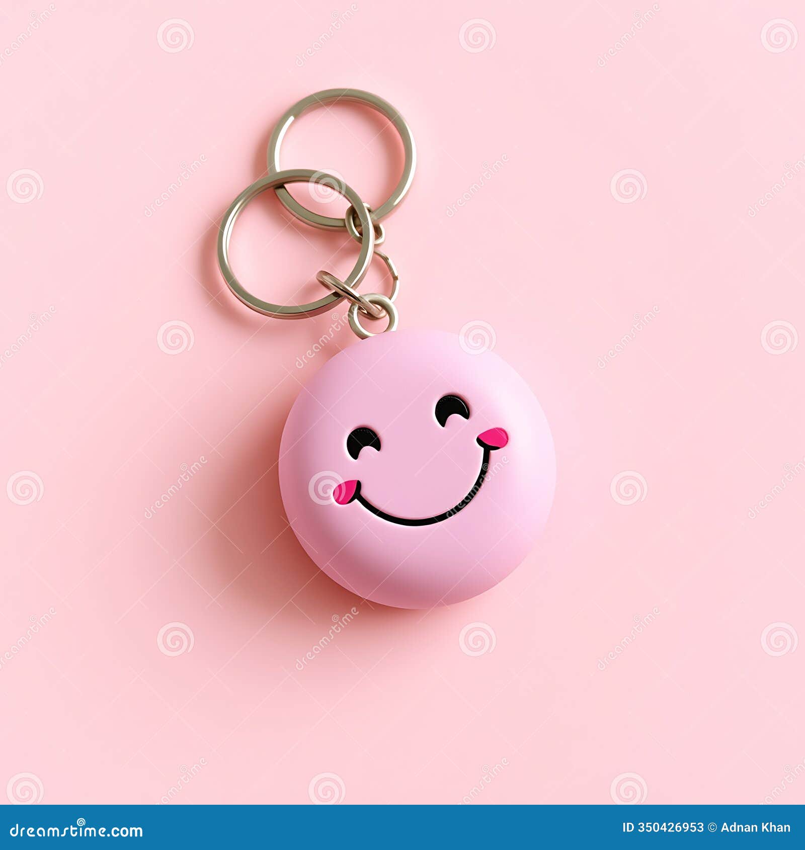 A Molar Keychain with a Smiley Face Design on a Pastel Blush Background ...