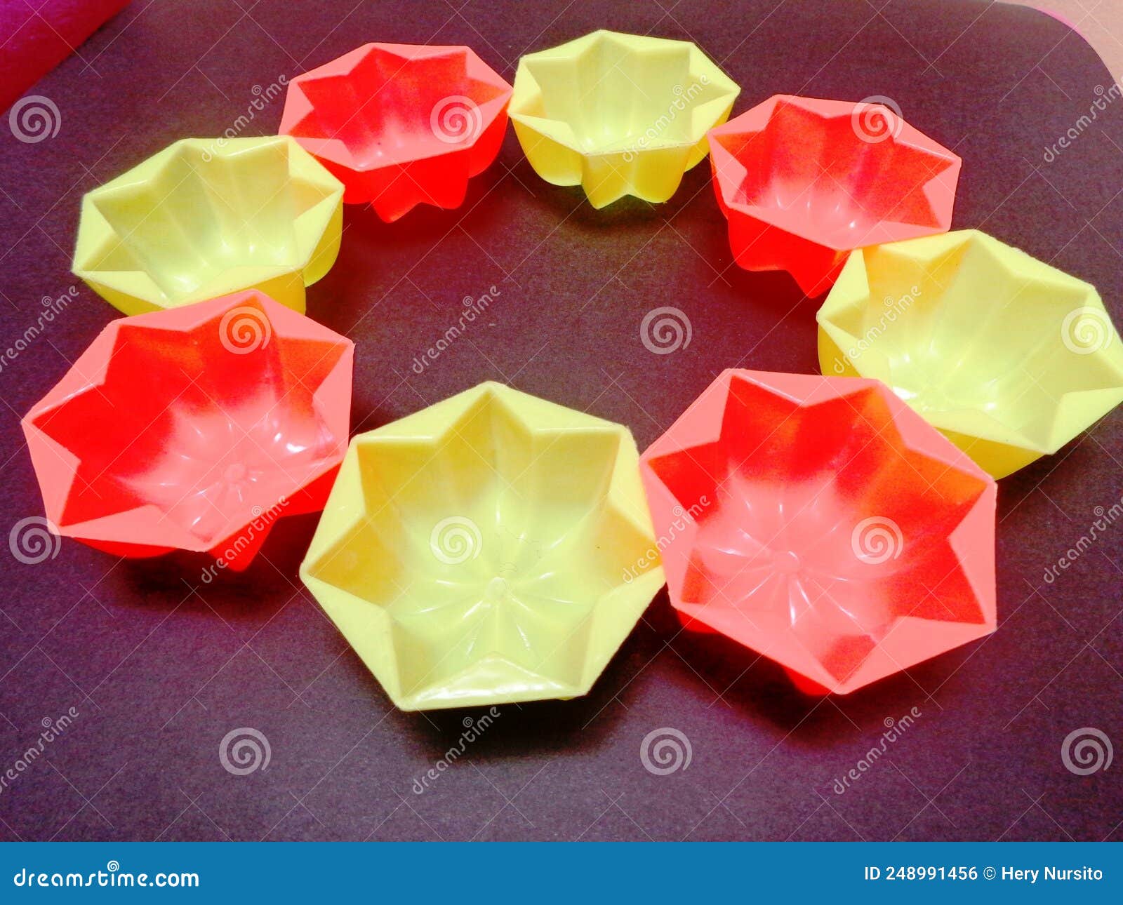 The Mold for Making Pudding is Made of Plastic with Red and Yellow ...