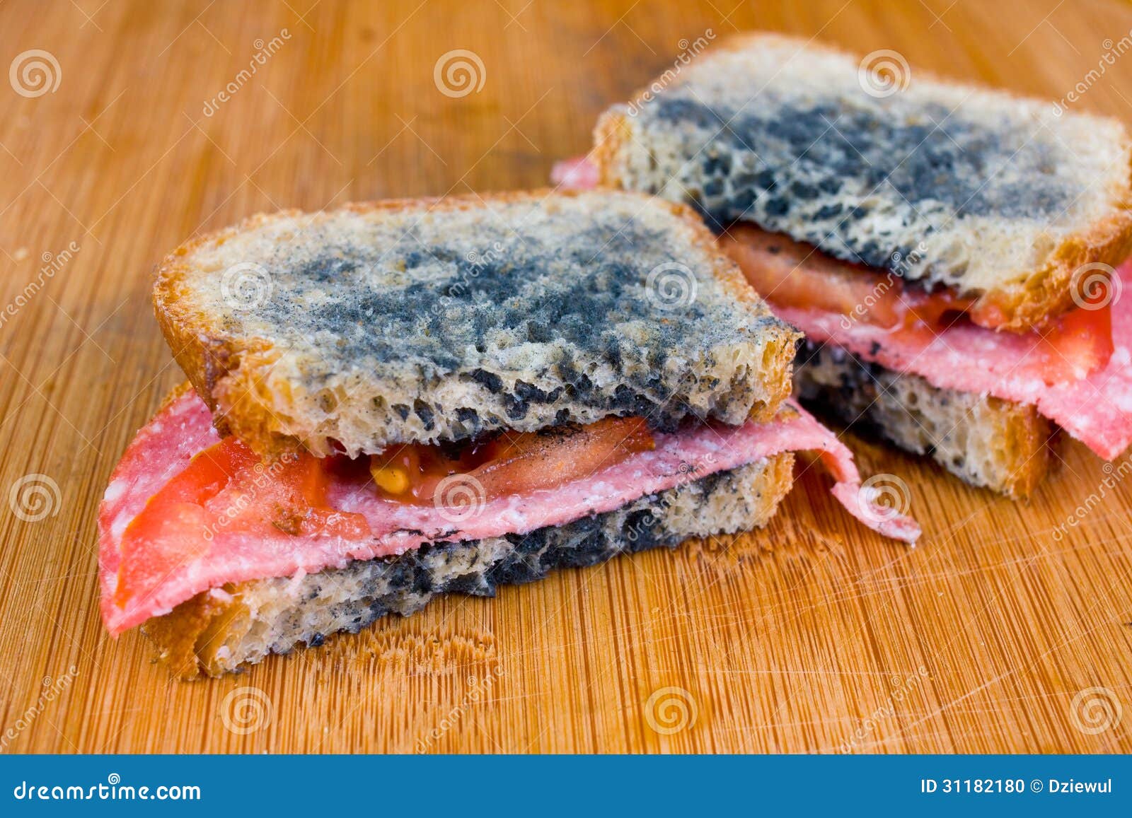 Moldy Sandwich with Salami, Tomatoes on a Chopping Board Stock Photo ...