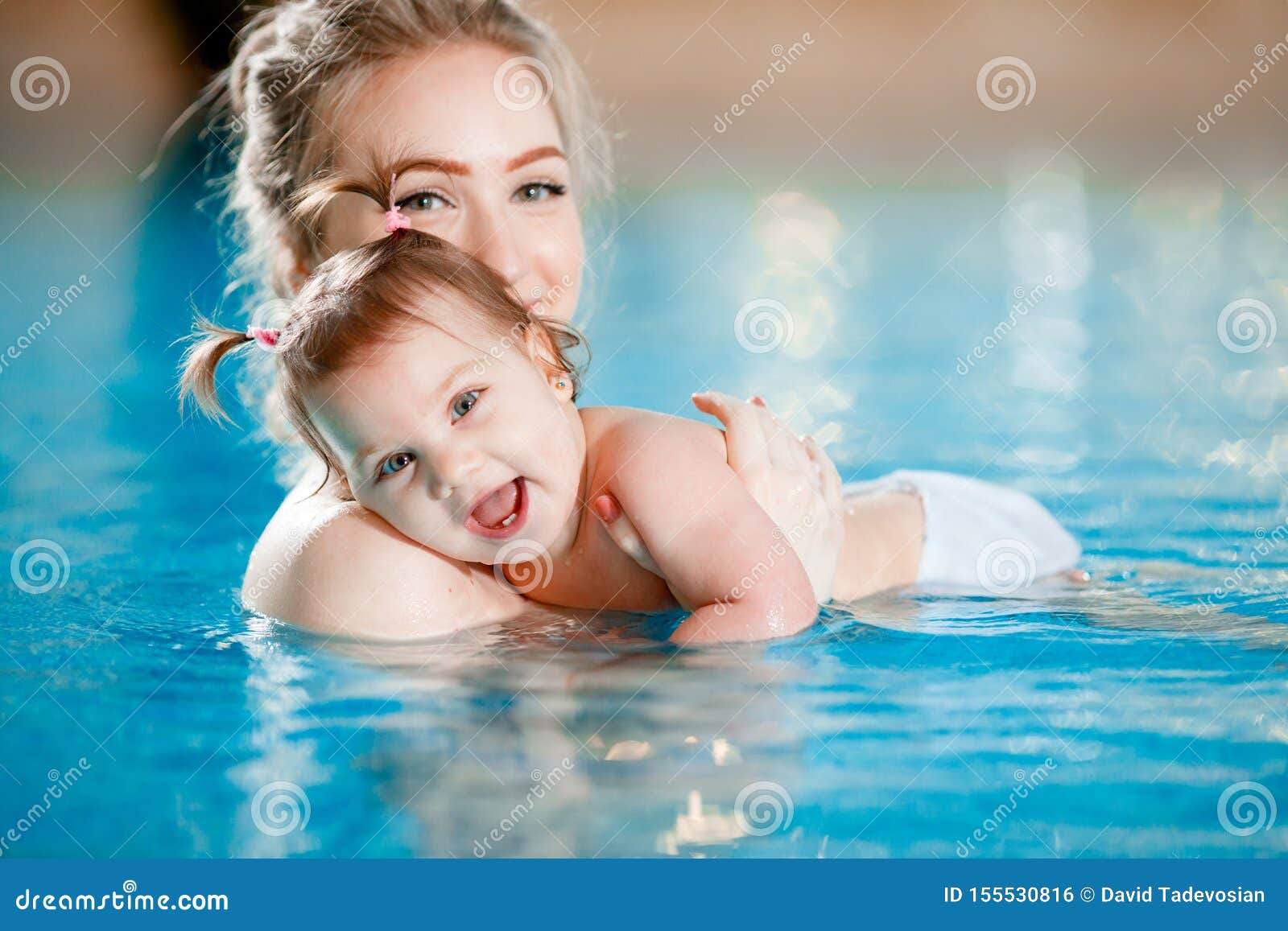 Mom and Baby Swim in the Pool. Stock Photo - Image of pool, early ...
