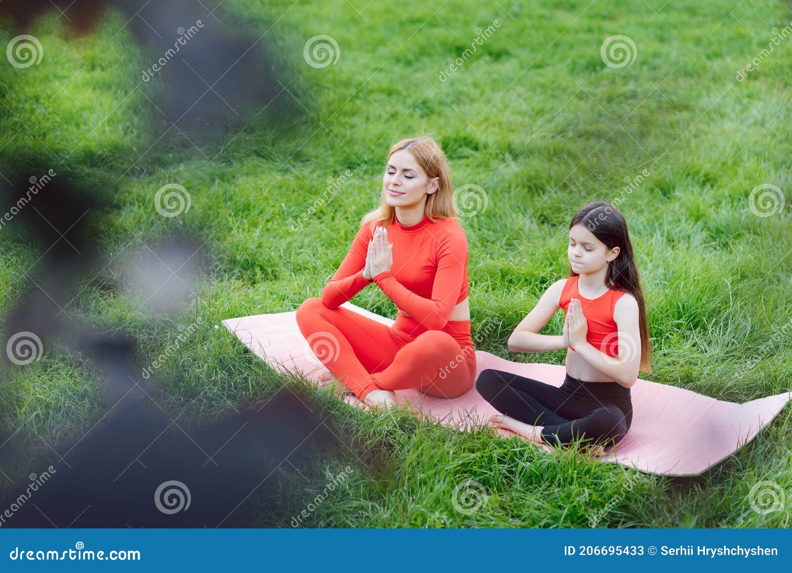 Mom and Child in the Lotus Position on the Nature Stock Image - Image ...