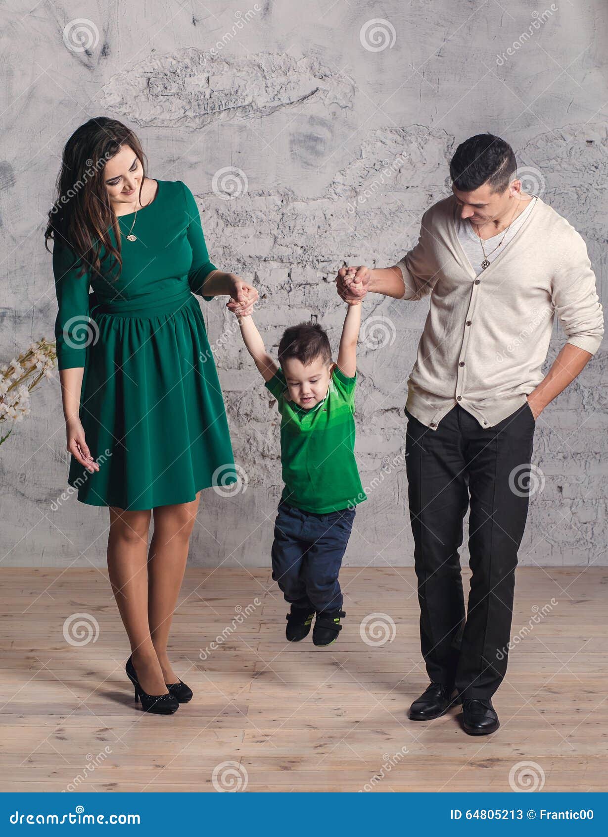 Mom and Dad Raise Child Up in Studio Stock Image - Image of parents ...
