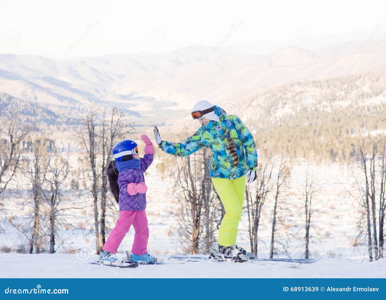Mom and Daughter Give High Five while Snow Skiing Stock Image - Image ...