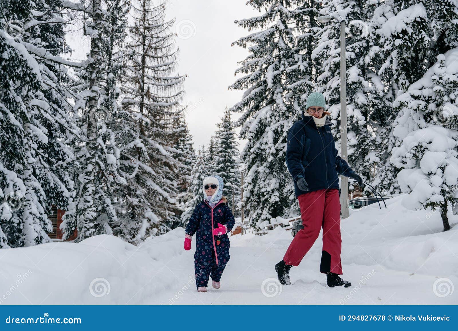 Mom and Daughter Playing on a Snow Stock Photo - Image of snowboard ...