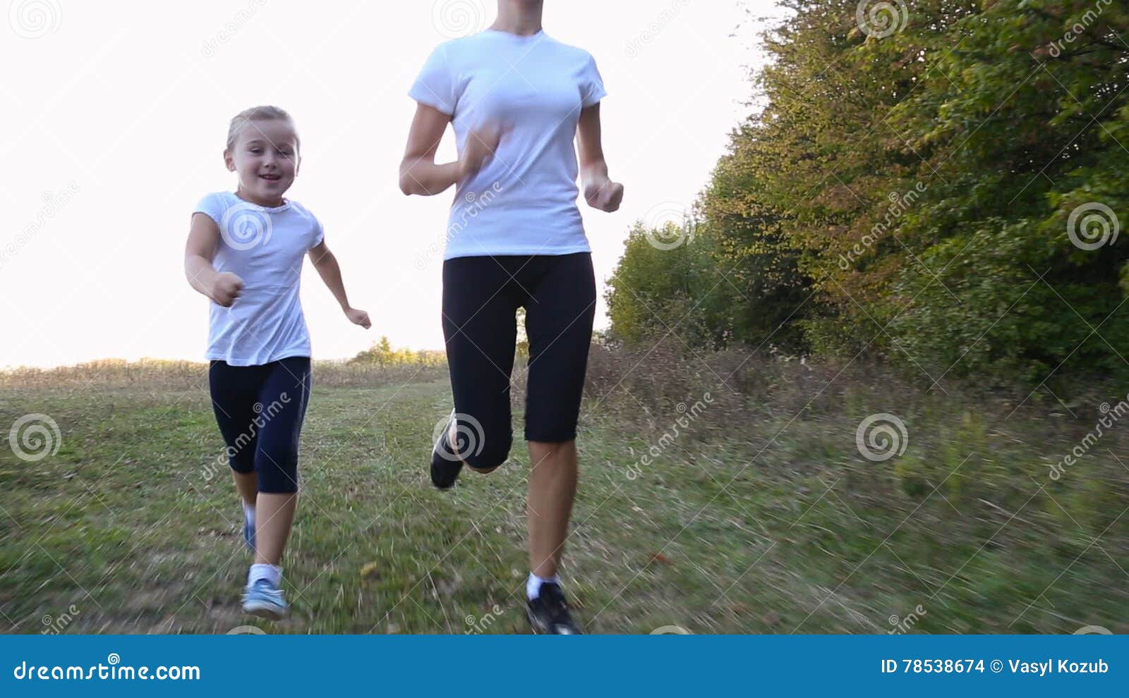 Mom and daughter running stock footage. Video of love - 78538674