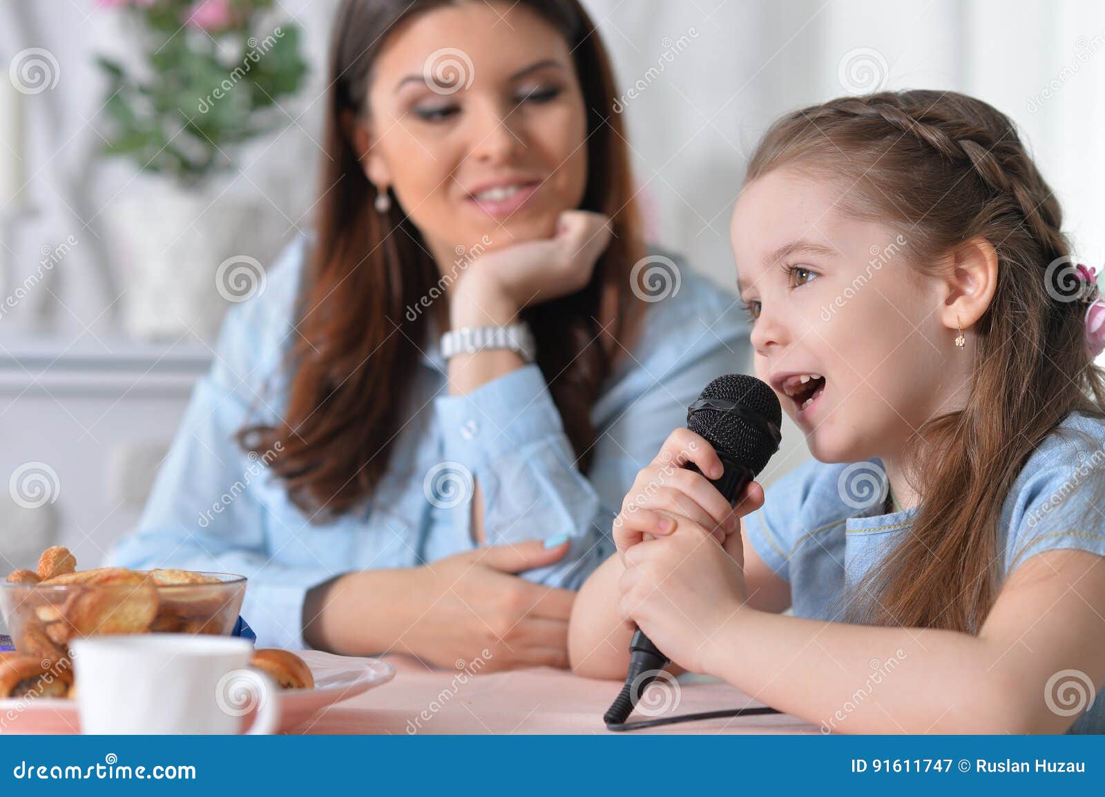 Mom and daughter sing stock image. Image of portrait - 91611747