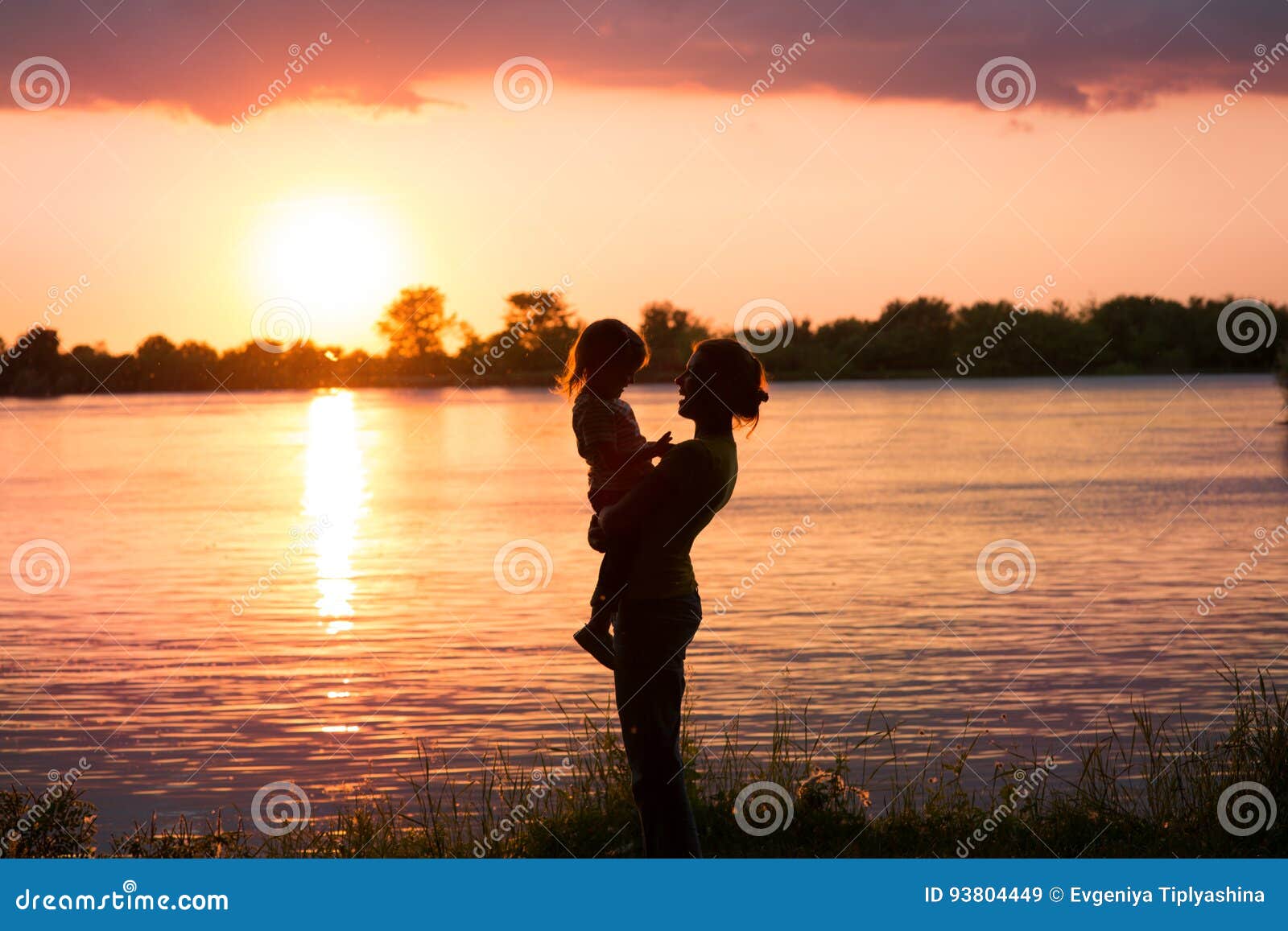 Mom and daughter at sunset stock image. Image of together - 93804449