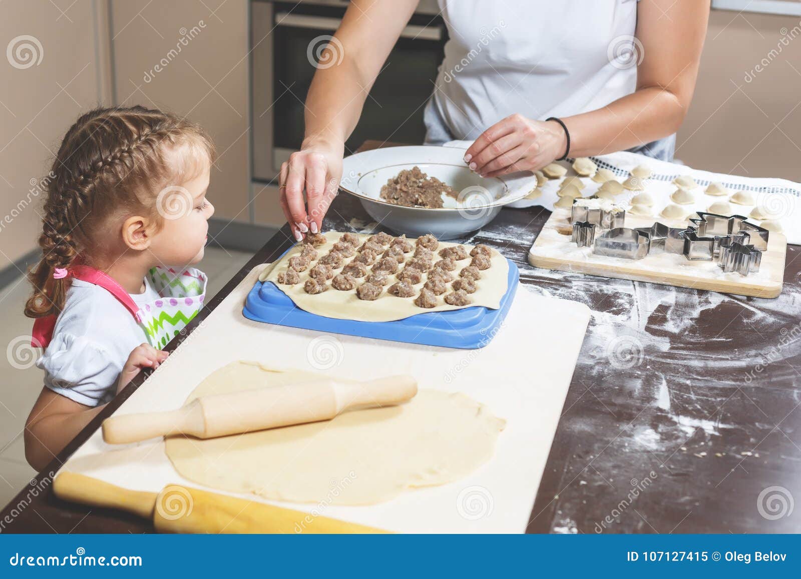 Mom and Daughter Together Make Dumplings in the Kitchen Stock Image ...