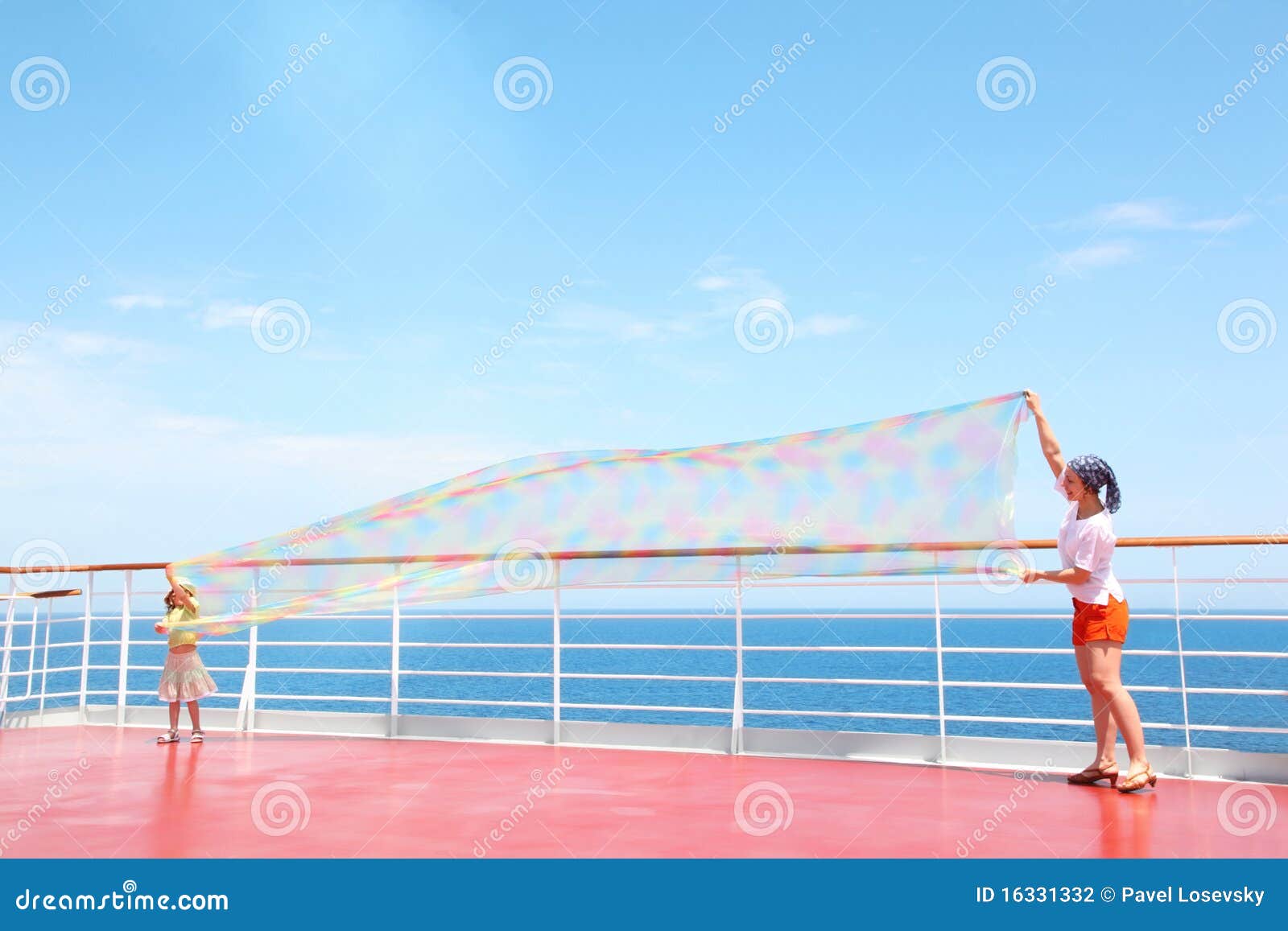 Mom and Daughter Unfolded Enormous Scarf on Deck Stock Photo - Image of ...
