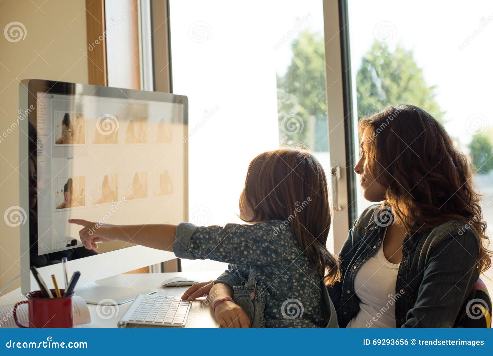 Mom and Daughter Using Computer Stock Photo - Image of photoshoot ...