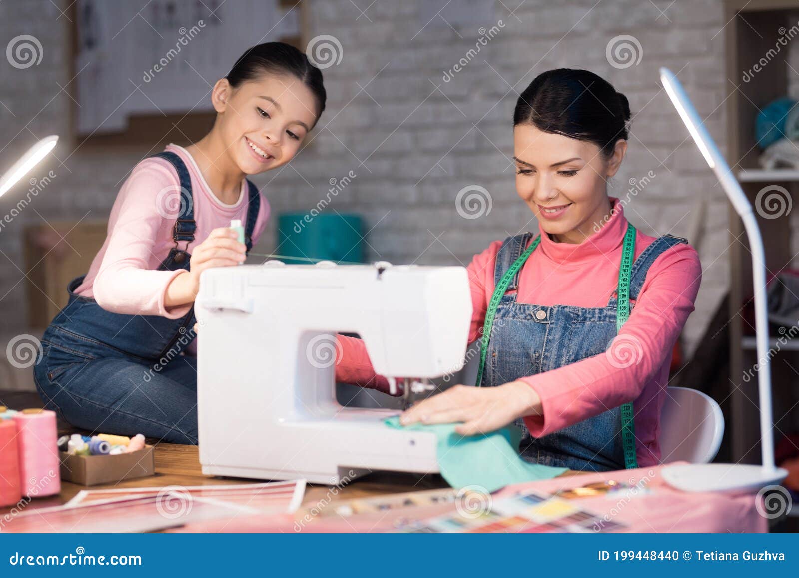 Mom and Daughter Sit at a Sewing Machine. Stock Photo - Image of ...