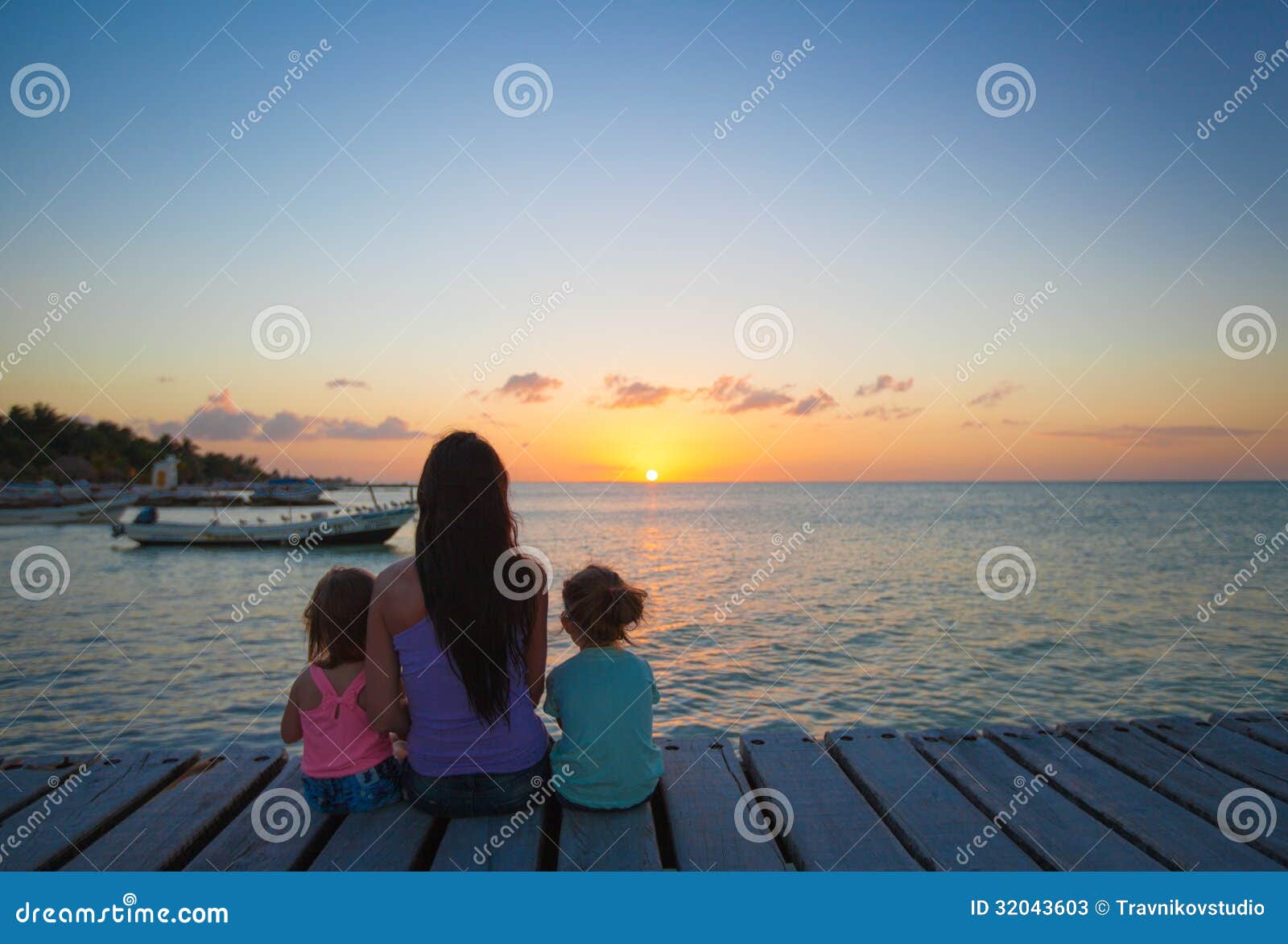 Mom and Daughters Silhouette in the Sunset on the Stock Image - Image ...