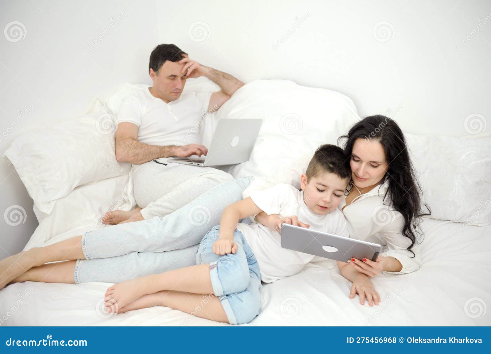 Mom Entertains Son on Tablet White Clothes One Bed Rest Apartments ... Mom Entertains Son on Tablet White Clothes One Bed Rest Apartments ...