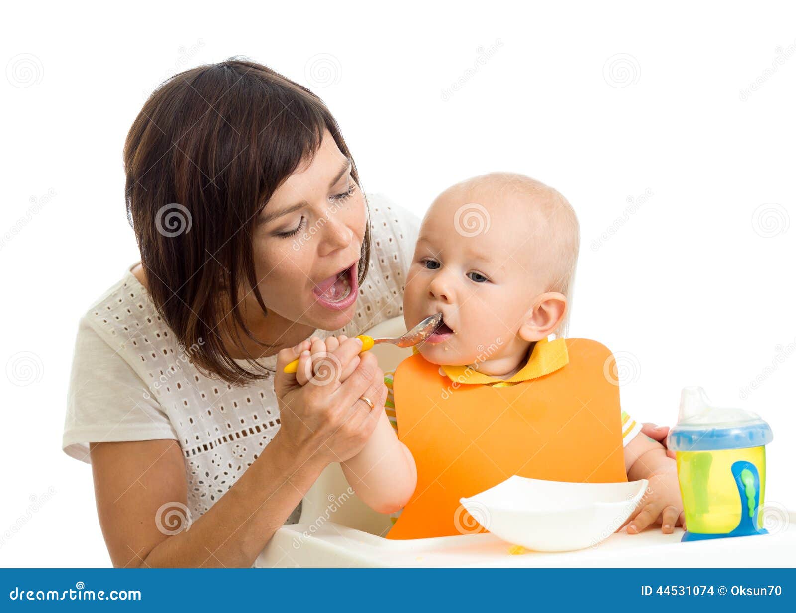 Mom feeding her kid boy stock photo. Image of family - 44531074