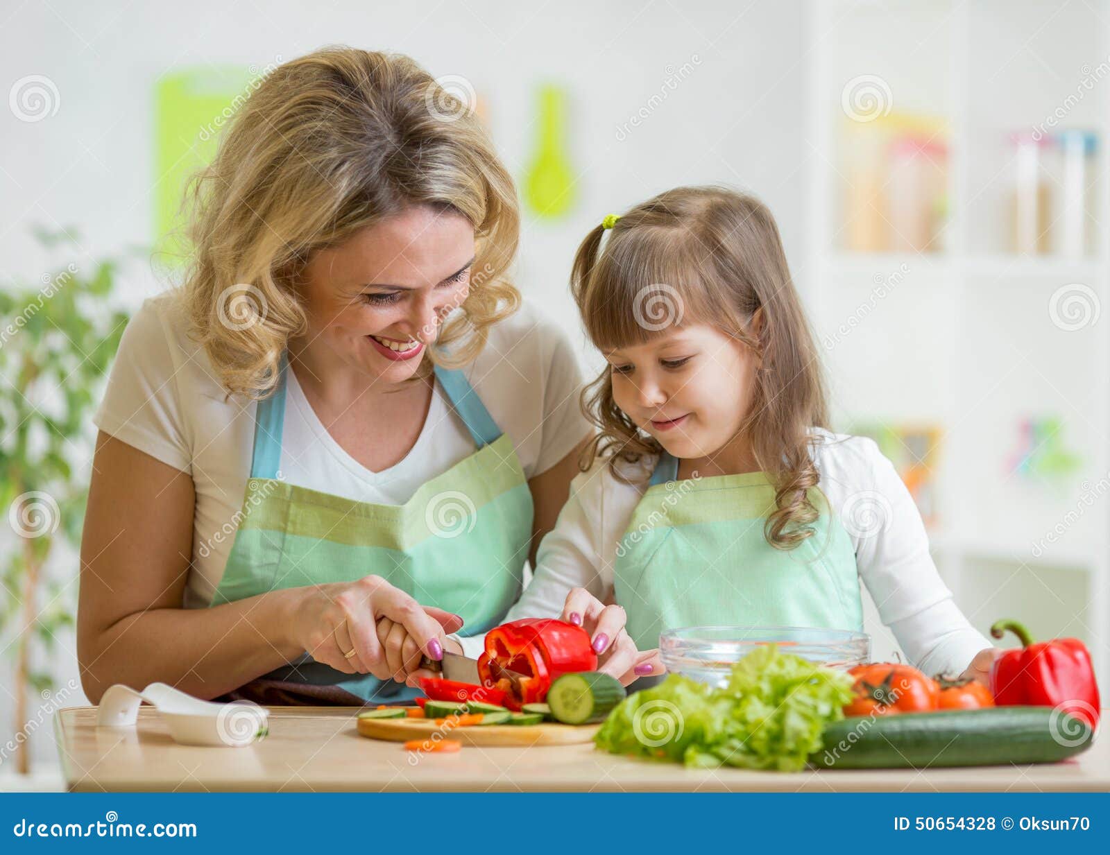 Mom and Her Daughter Preparing Vegetables at Stock Photo - Image of ...
