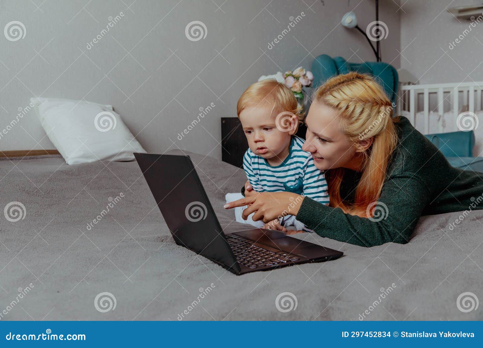 Mom with Kid with Computer at Home on the Bed Editorial Stock Image ...