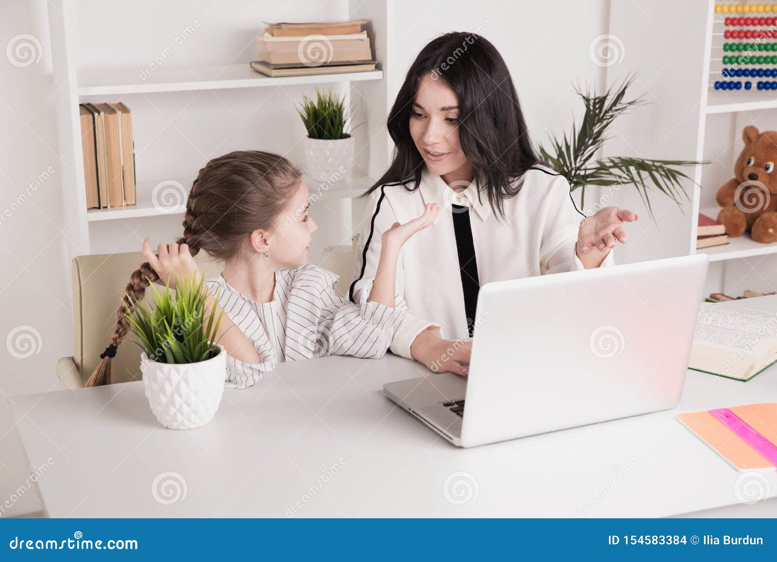 Mom and Kid Using Laptop Together and Teaching in Internet. Stock Photo ...