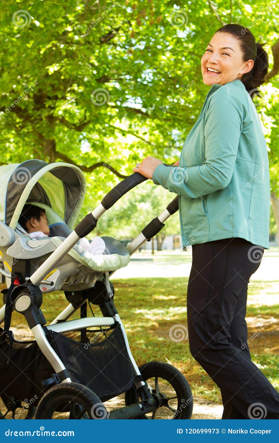 Mom Pushing Her Baby in a Stroller. Stock Image - Image of stroller ...