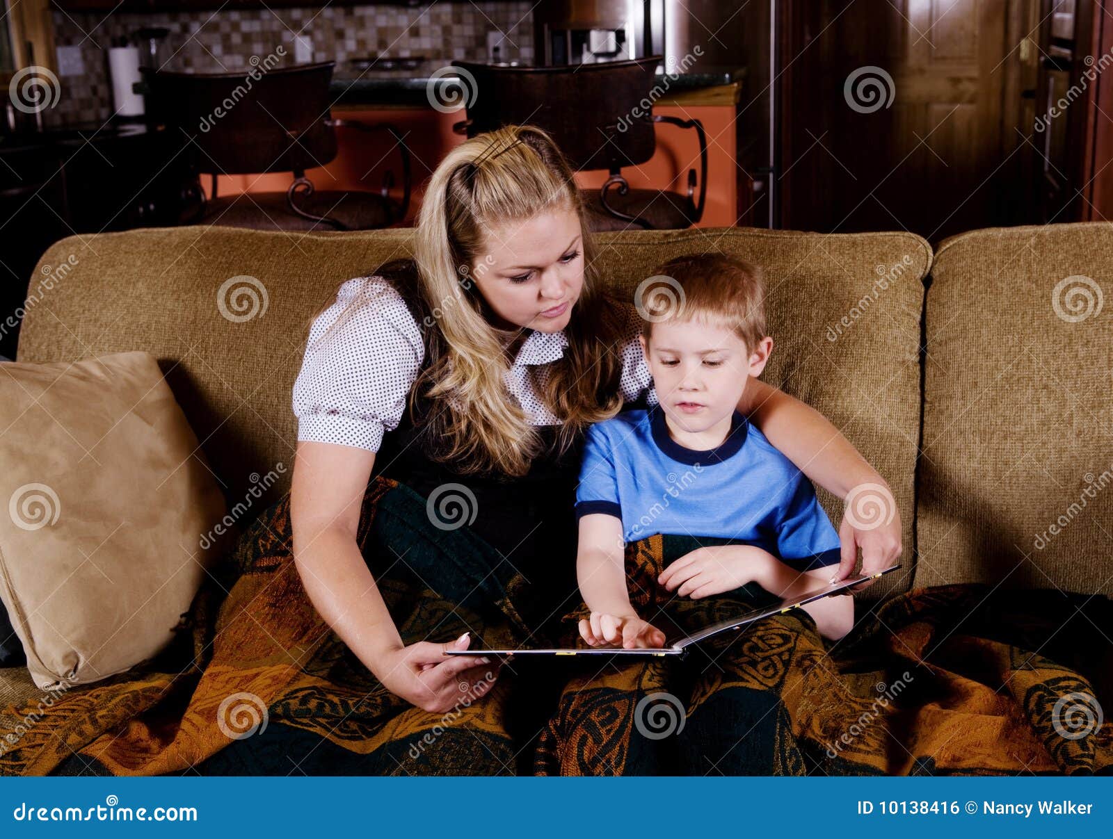 Mom Reading a Book To Her Child Stock Photo - Image of male, home: 10138416