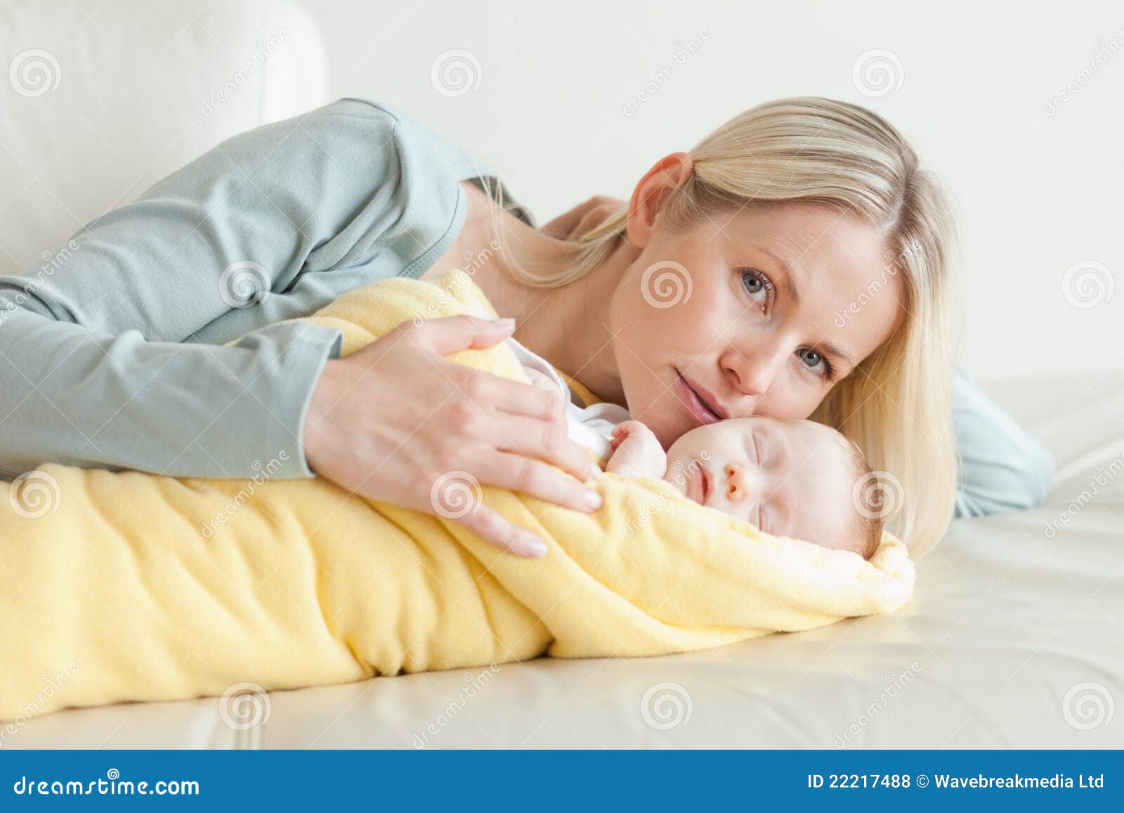 Mom Relaxing Next To Her Baby Stock Photo - Image of care, childhood ...