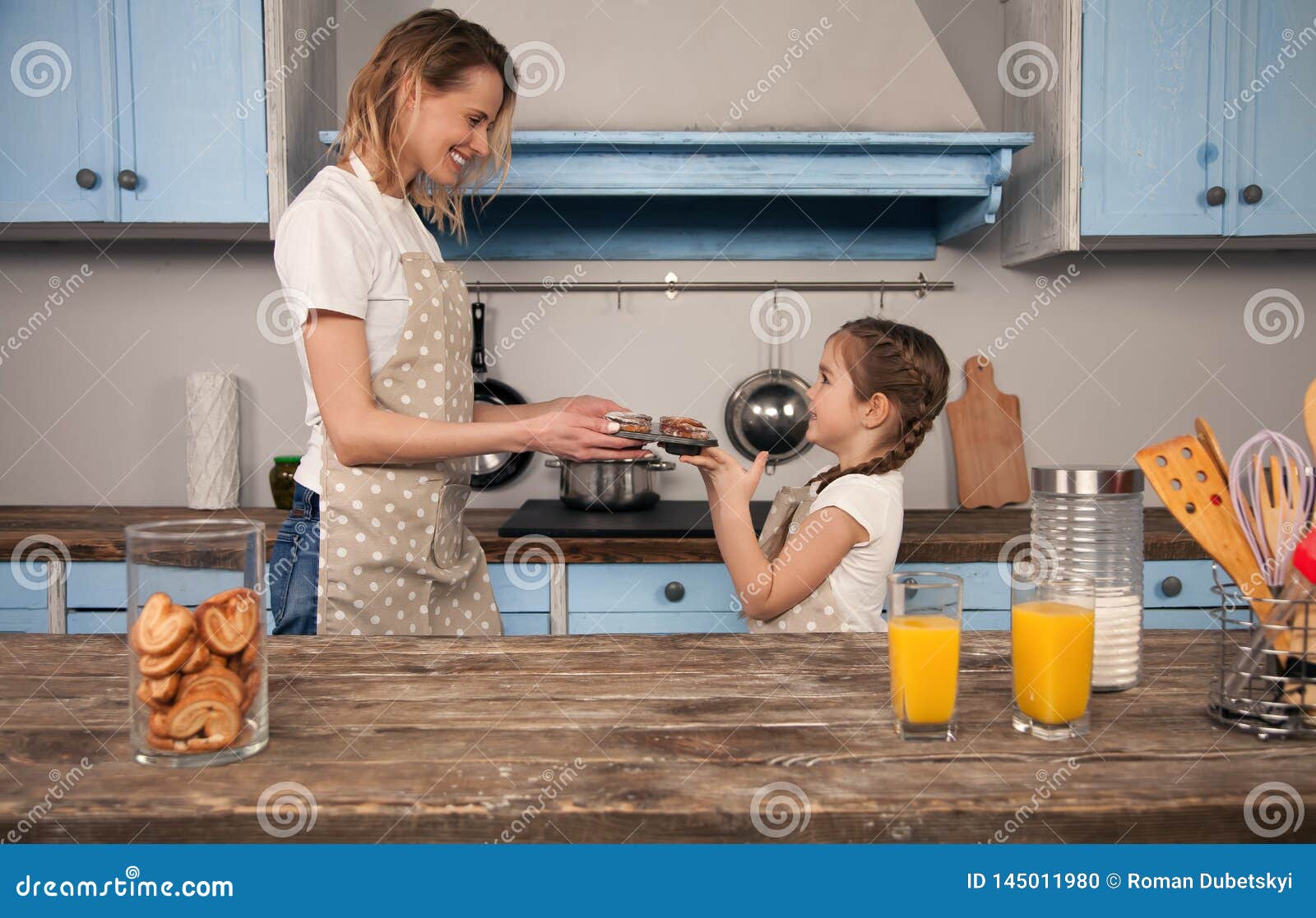 Mom Shows Her Daughter Cupcakes they Just Cooked Stock Photo - Image of ...