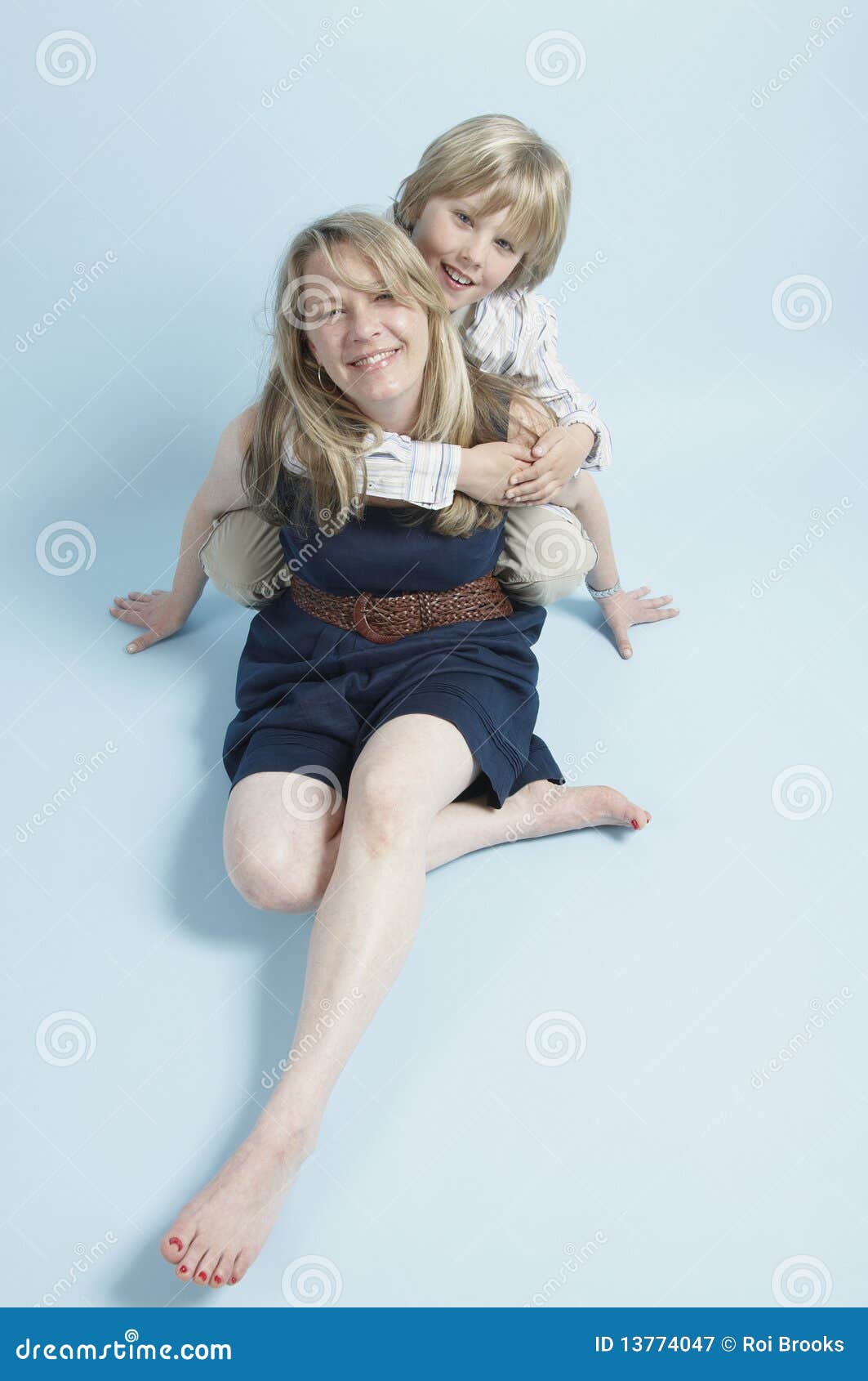 Mom Sitting On The Floor With Her Son Stock Image - Image of blond ...