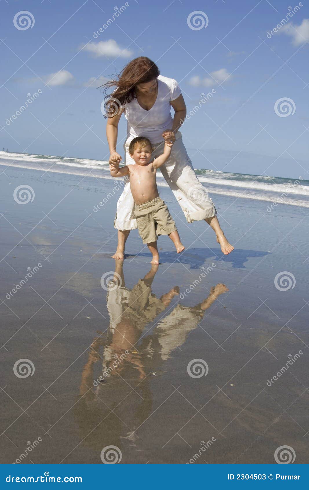 Mom and son on a beach stock image. Image of resort, solitude - 2304503