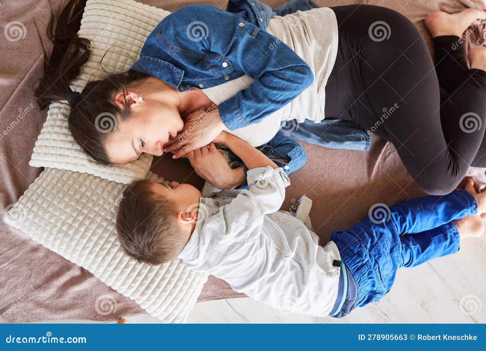Mom And Son Cuddle Together On A Blanket Stock Image Image Of