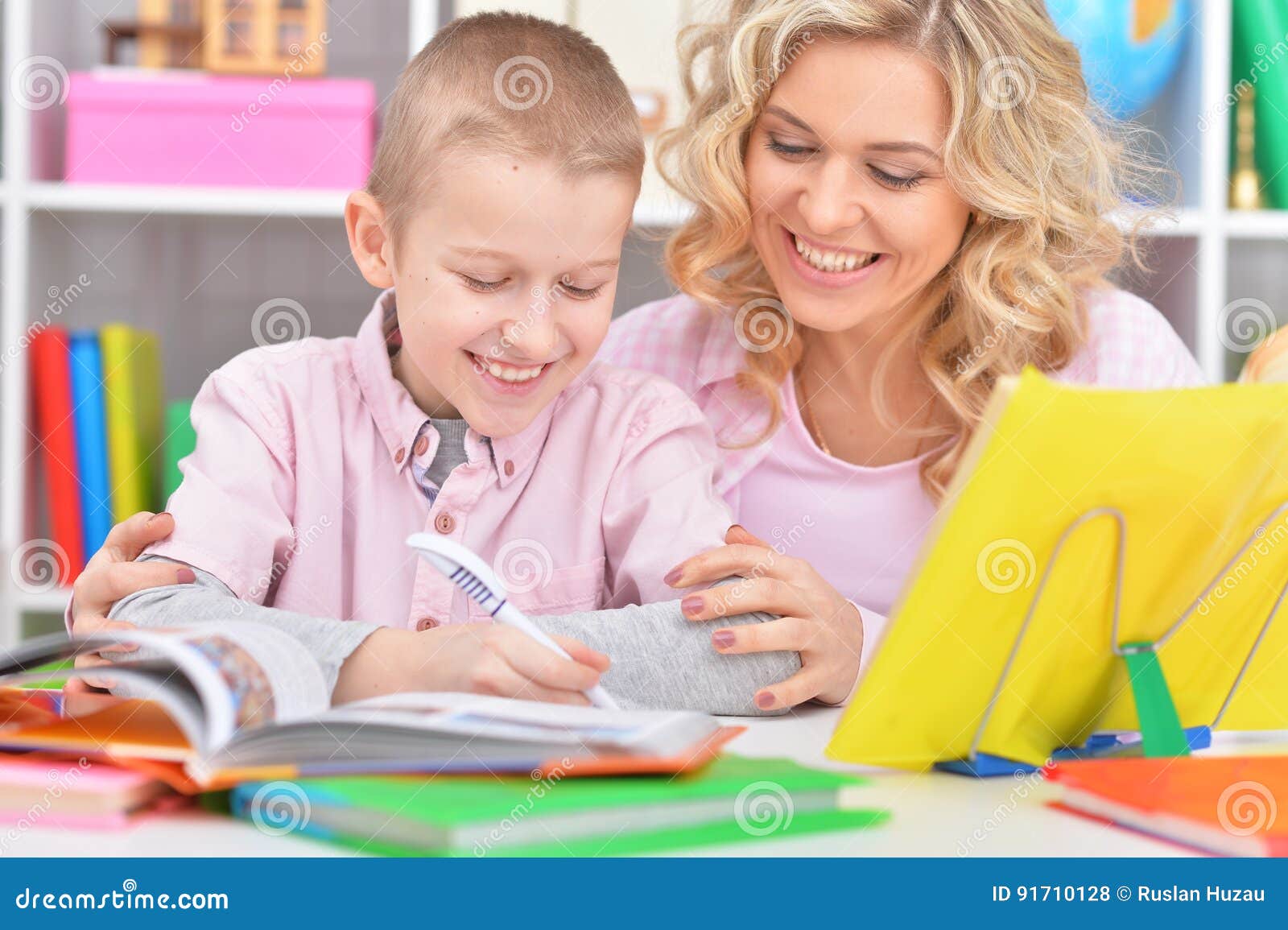 Mom and son doing lessons stock photo. Image of education - 91710128