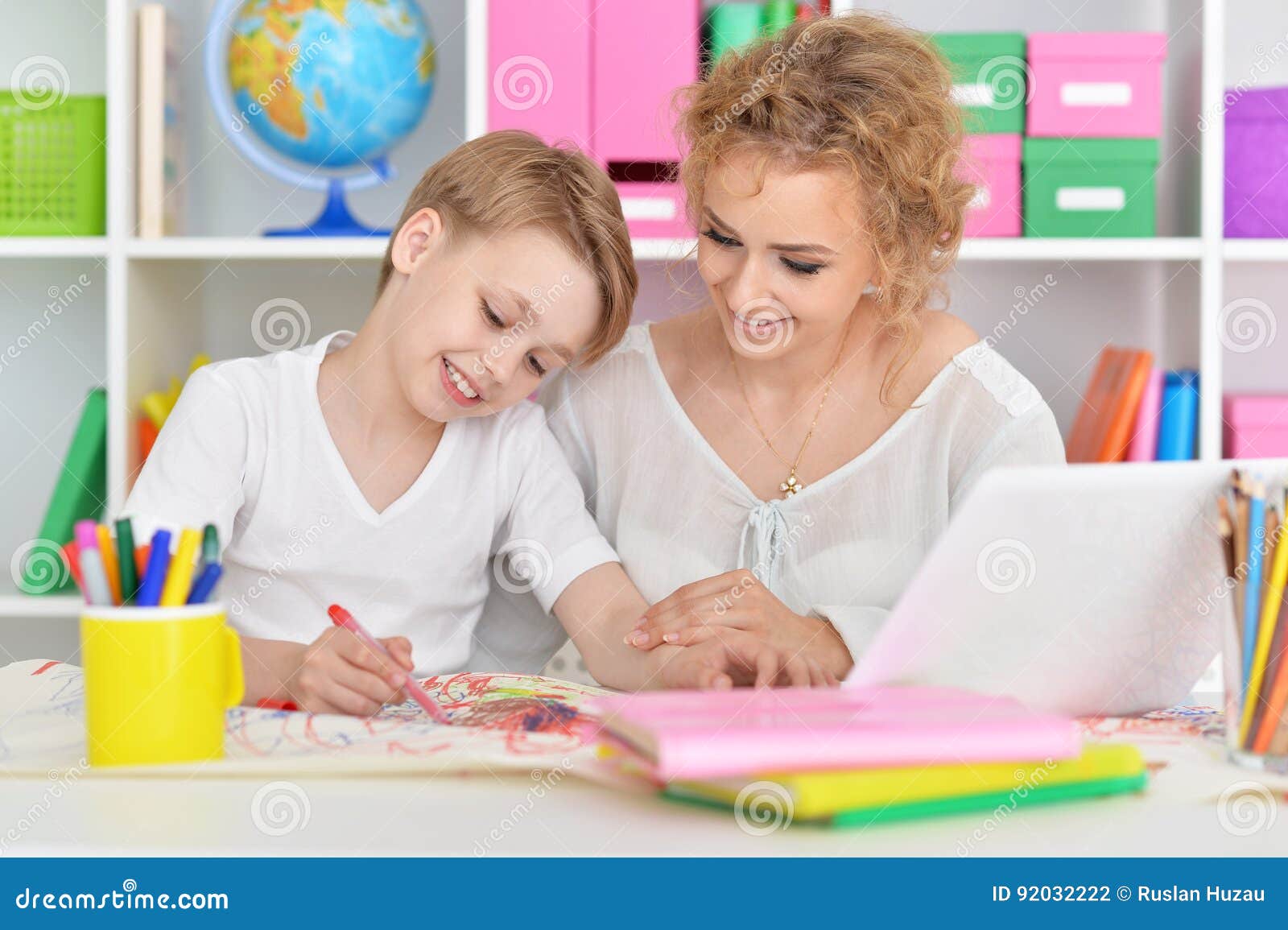 Mom and son doing lessons stock photo. Image of childhood - 92032222