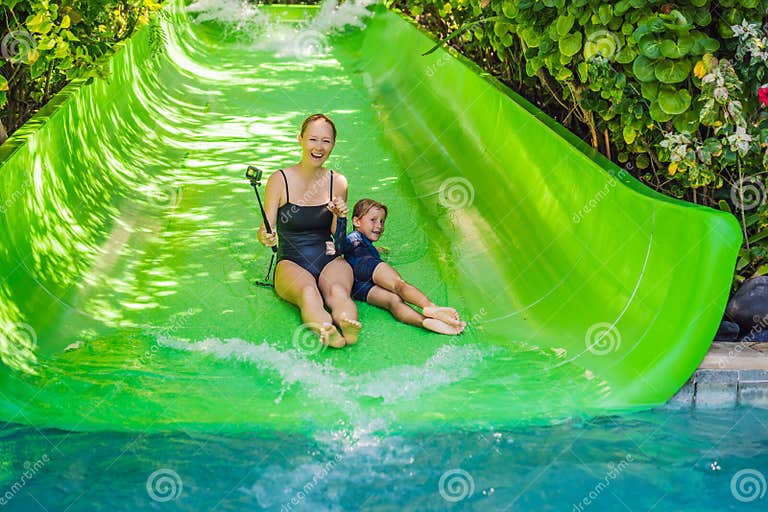 Mom And Son Have Fun At The Water Park Stock Image Image Of Blurred