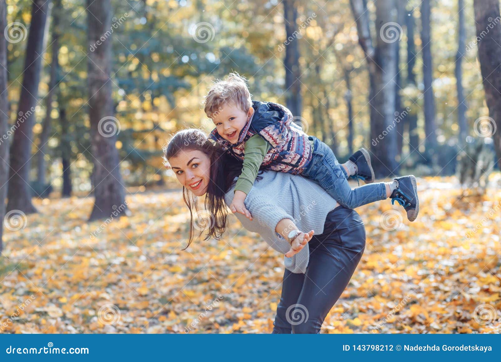 Mom and Son Having Fun in the Park in Autumn Stock Photo - Image of ...