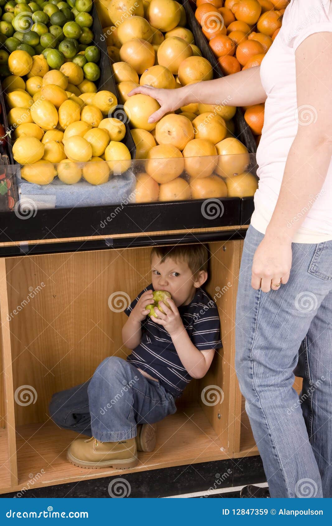 Mom standing eating apple stock image. Image of family - 12847359