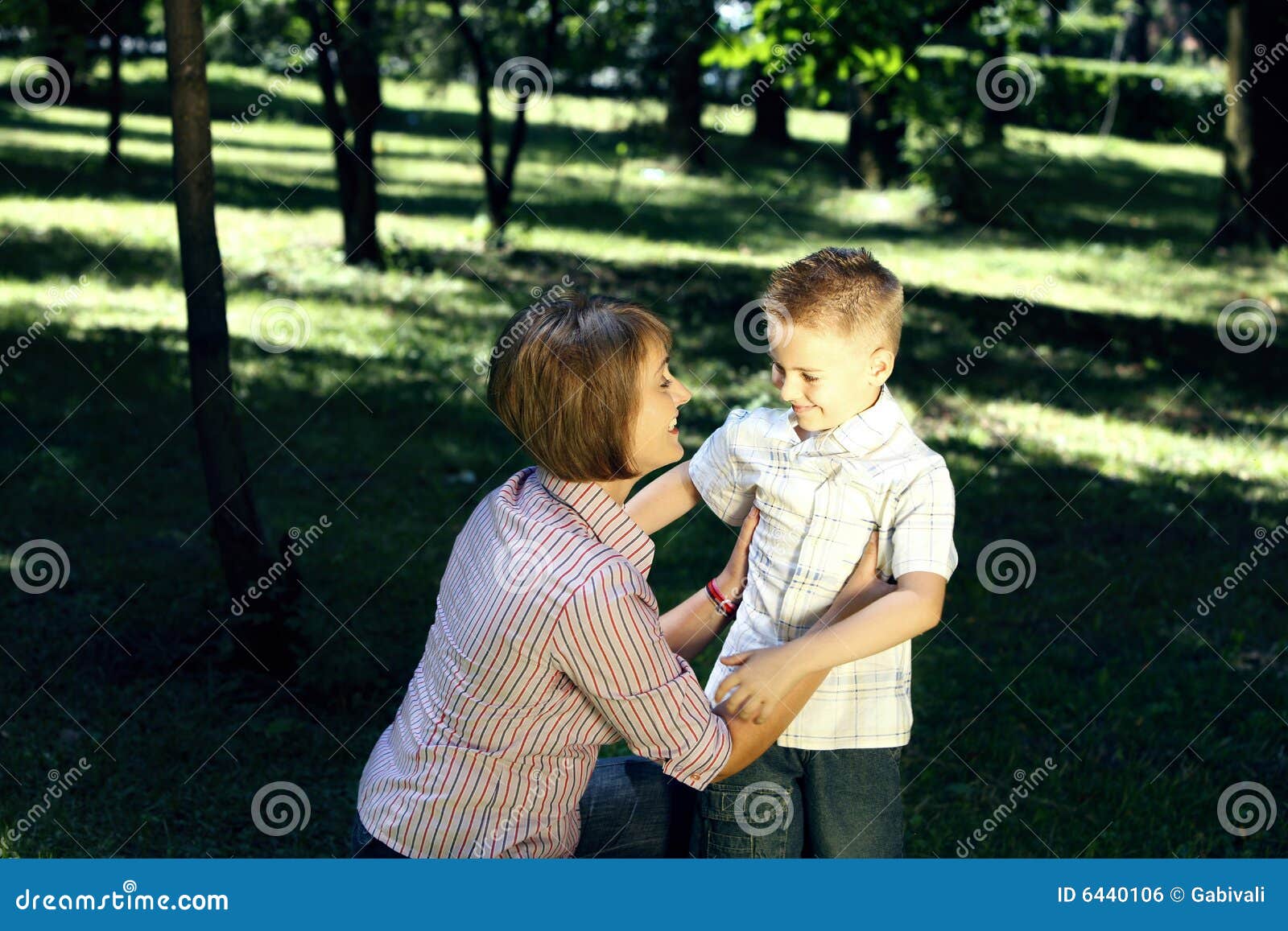 Mom and Sun Hugging Outdoors Stock Photo - Image of hugging, loved: 6440106