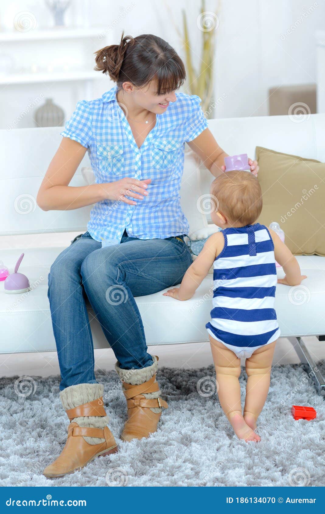 Mom teaching baby to walk stock photo. Image of mommy - 186134070