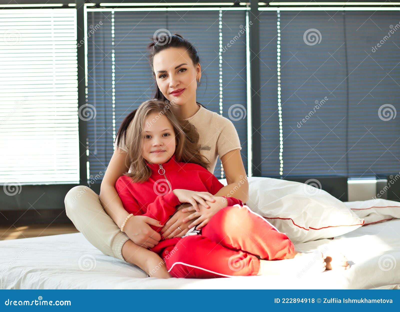 Mom Wakes Up Daughter In The Morning Woman With Young Girl In Bed