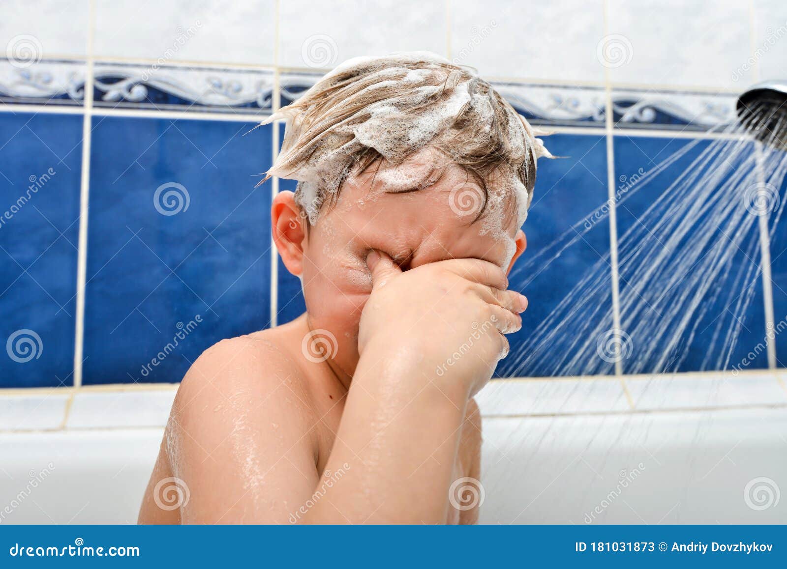 Mom Washes Shampoo From The Head Of A Child Whose Eyes Are Closed ...