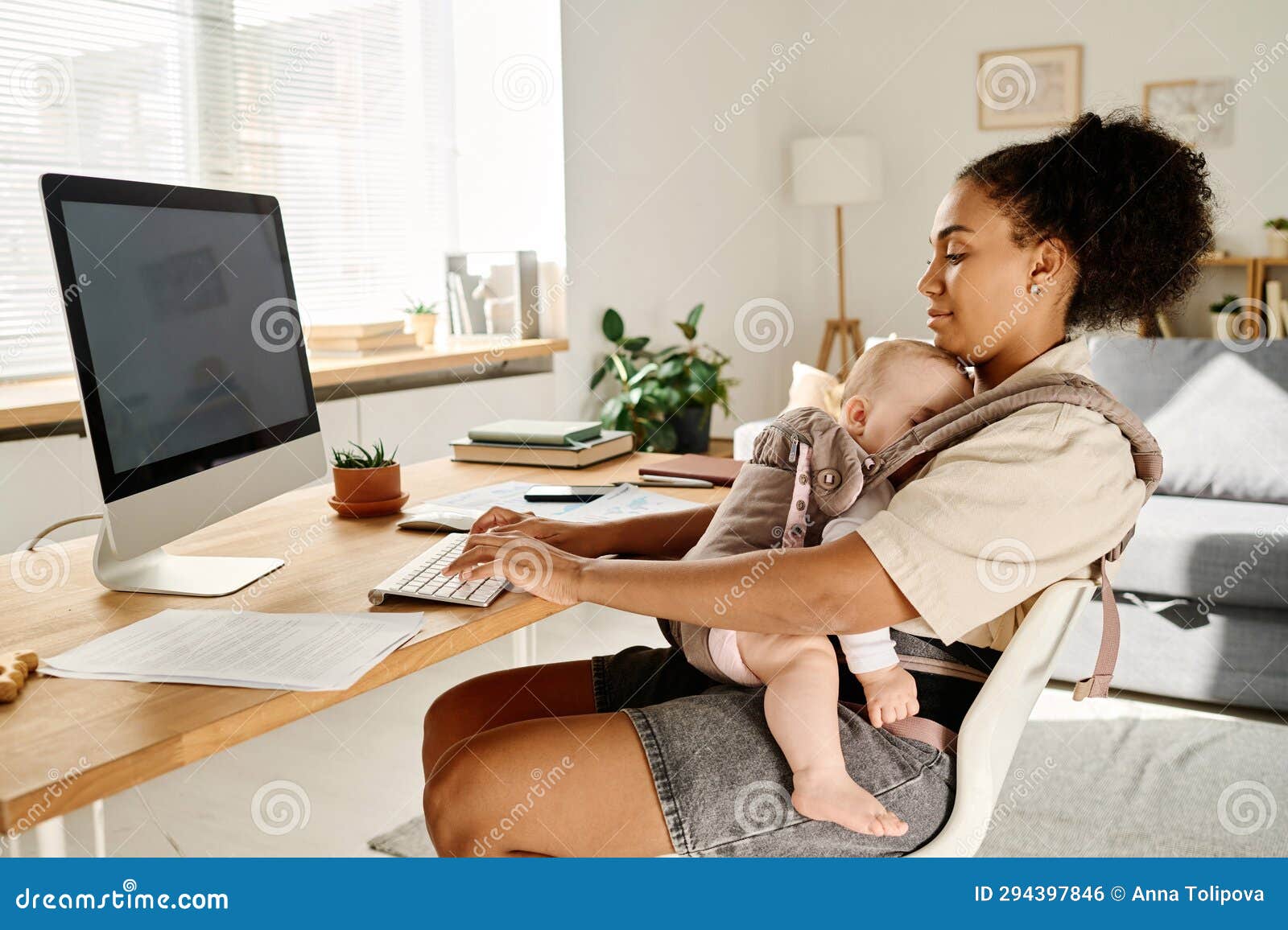 Mom Working on Computer with Her Baby Stock Photo - Image of sling ...