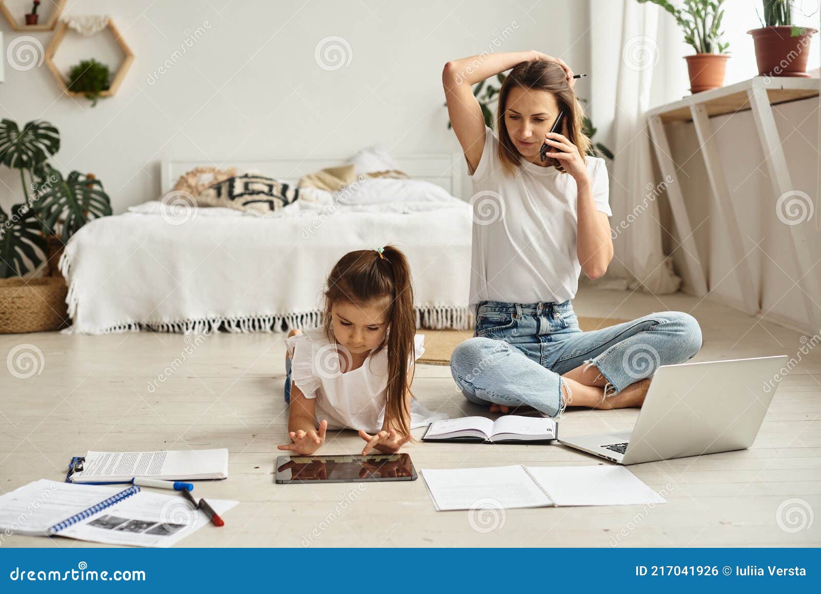 Mom Works at the Computer while Playing with Her Daughter Stock Photo ...