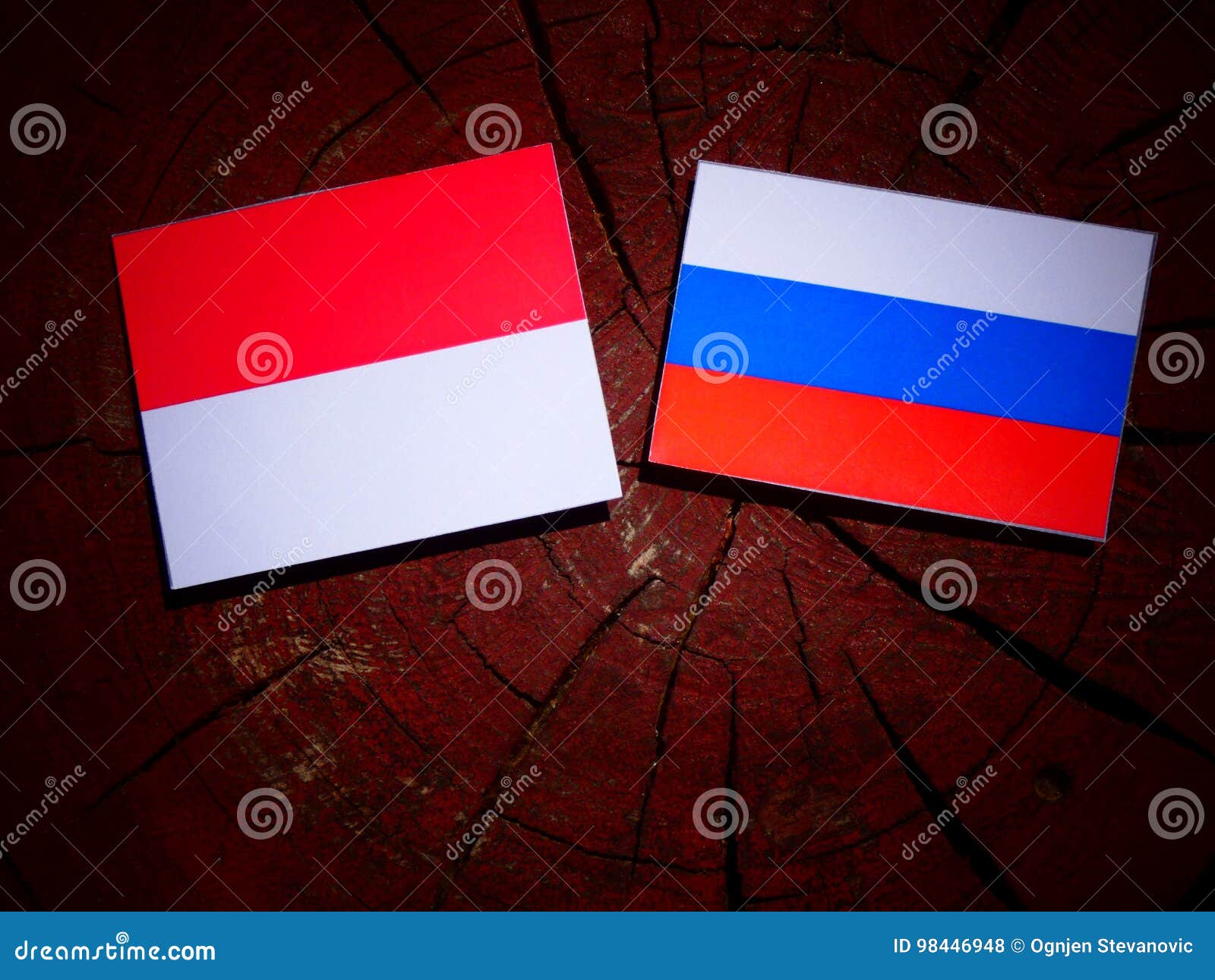 Monaco Flag with Russian Flag on a Tree Stump Stock Photo - Image of ...