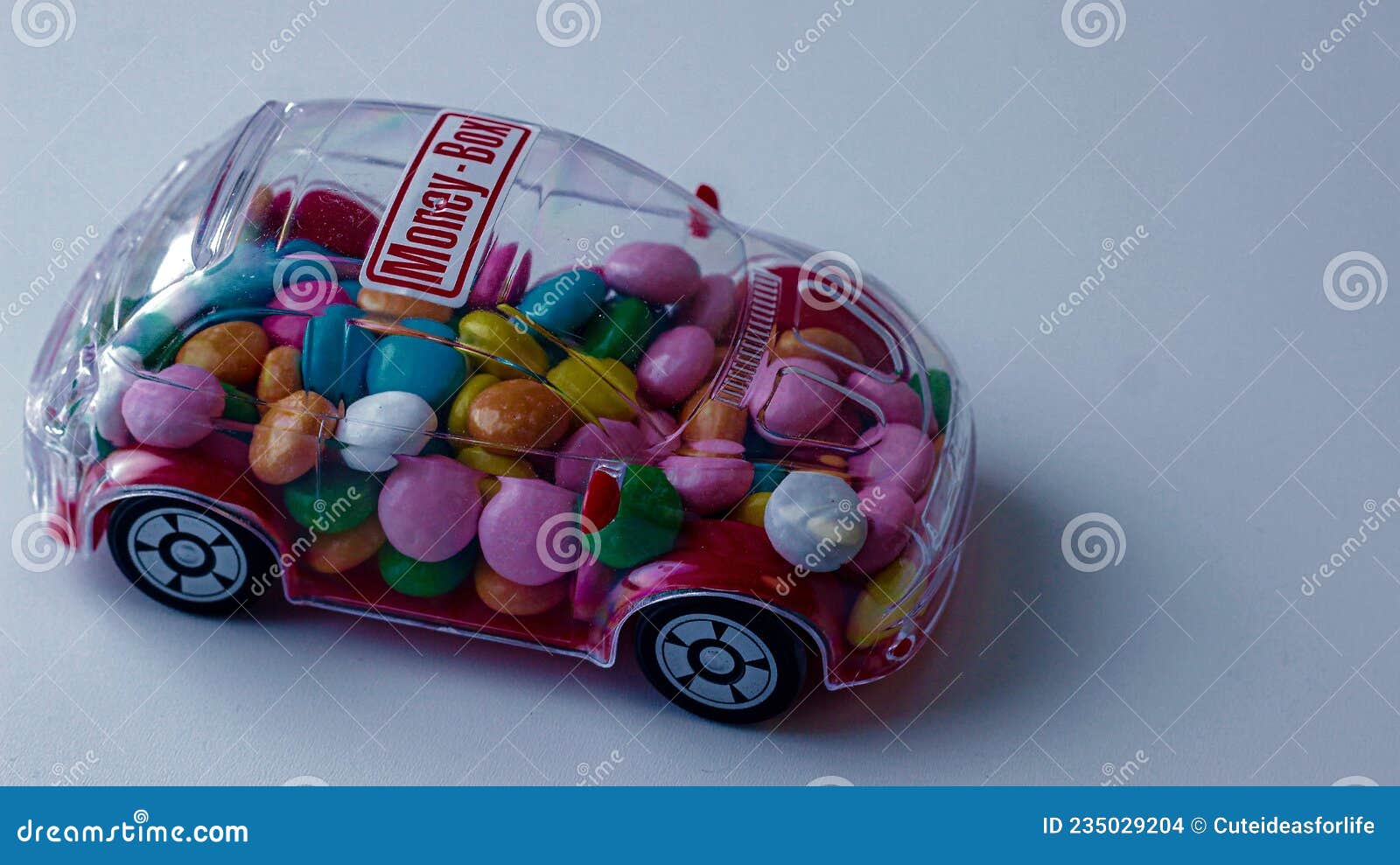Money-box car with candy stock photo. Image of save - 235029204
