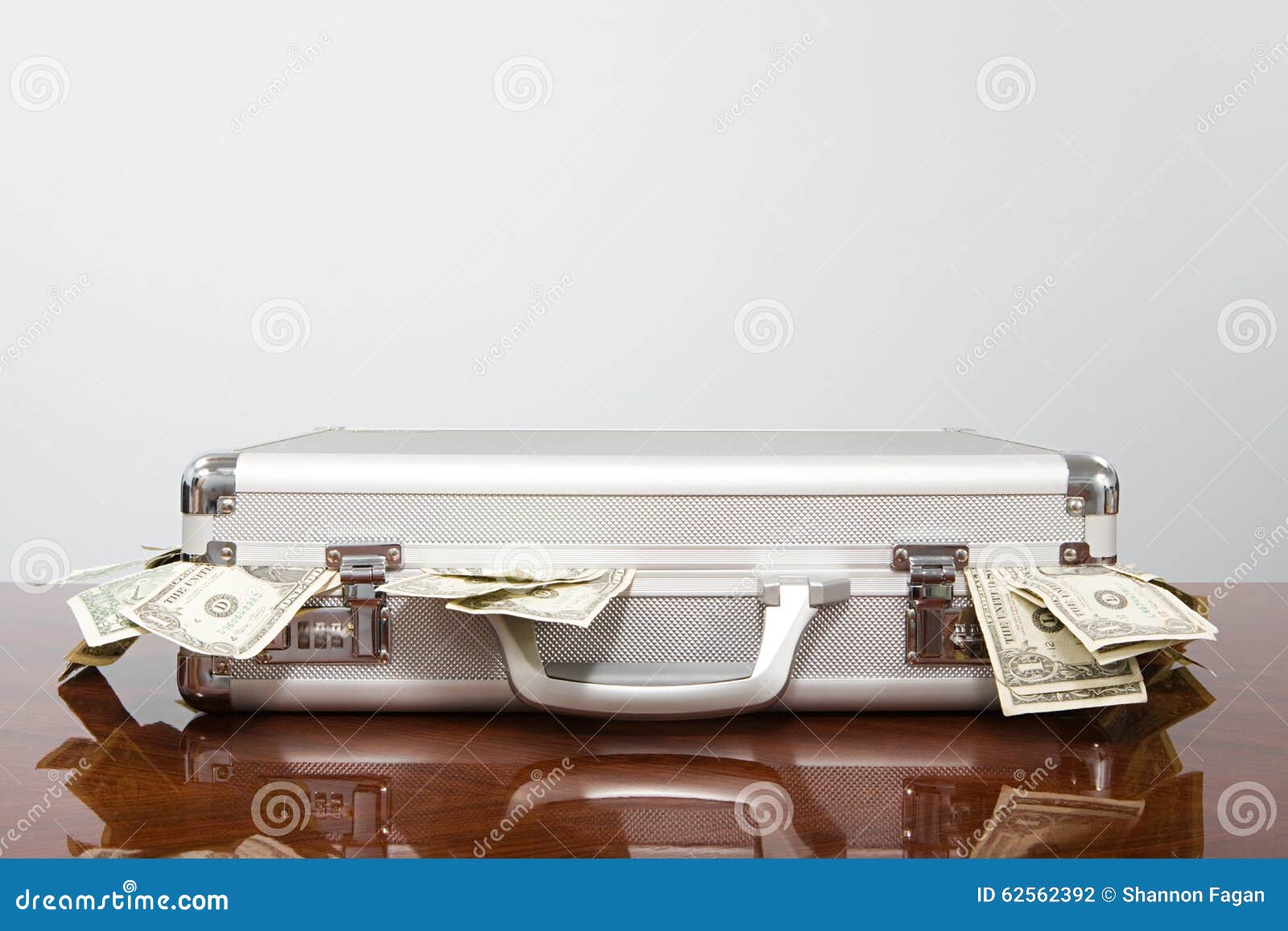 Money in a briefcase stock photo. Image of dollar, greed - 62562392