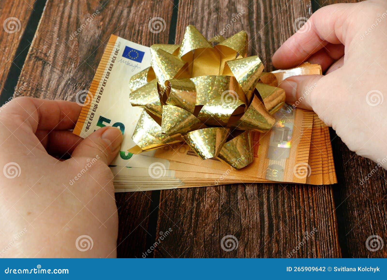 Money Gift, Big Stack of Money with Golden Bow on Wooden Background ...