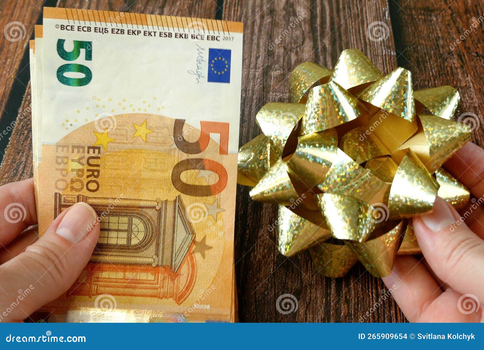 Money Gift, Big Stack of Money with Golden Bow on Wooden Background ...