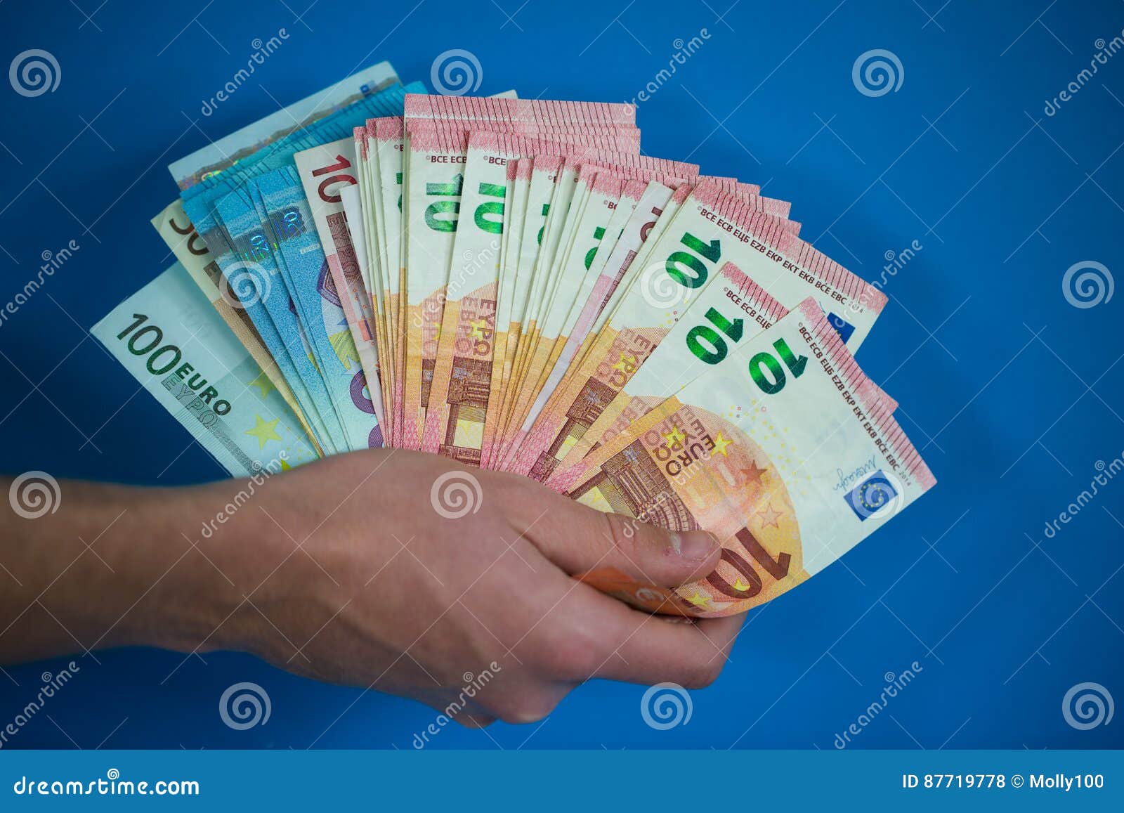 Money in the Hand , Blue Background Stock Photo - Image of newly ...