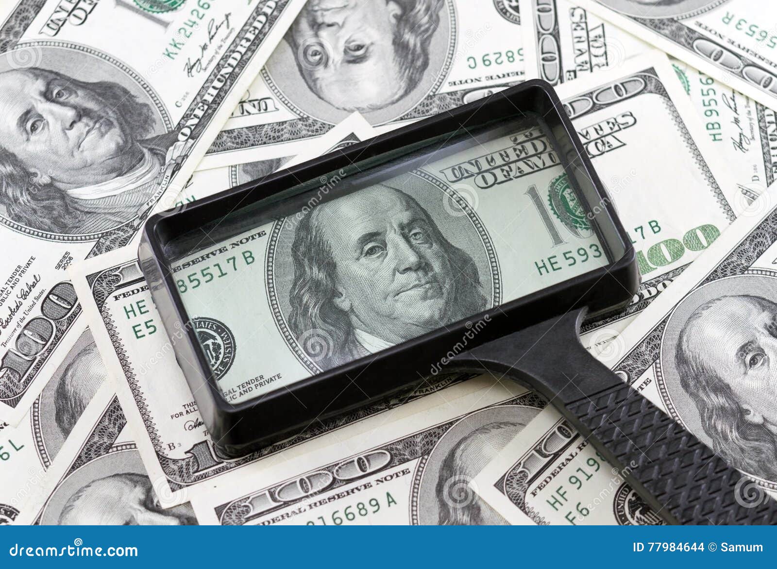 Money and magnifying glass stock photo. Image of magnification - 77984644