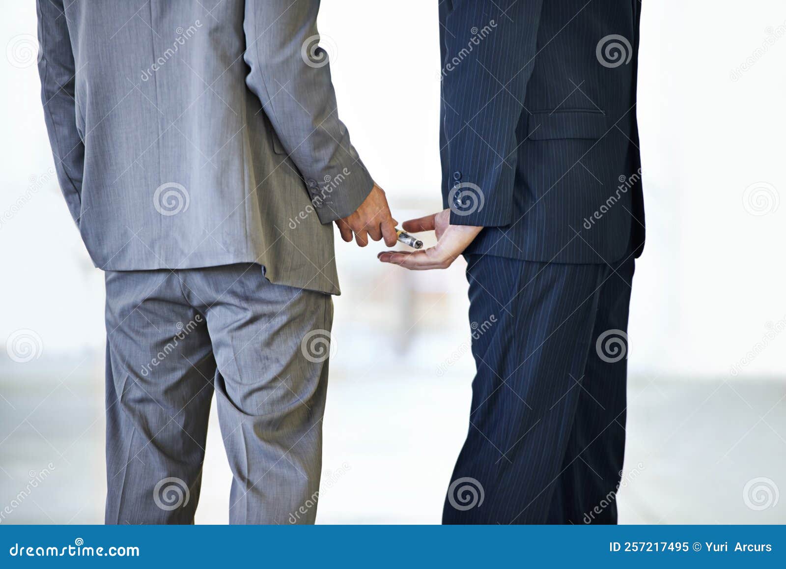 Money Passing Hands. Cropped Studio Shot of Money Being Placed in a ...